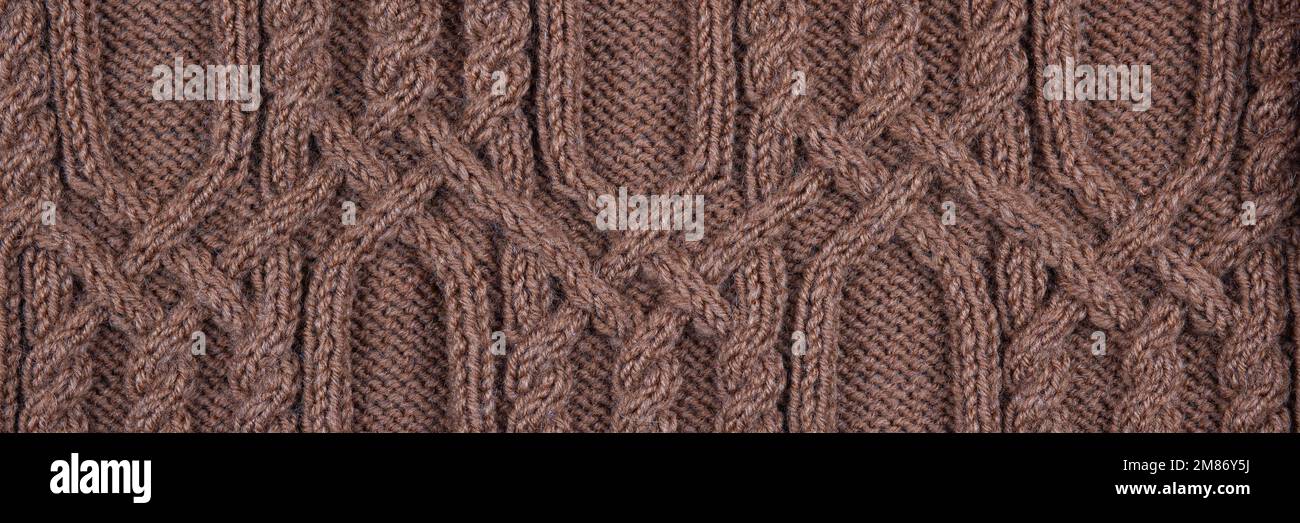 Knitted brown background banner. Large knitted fabric with a pattern ...
