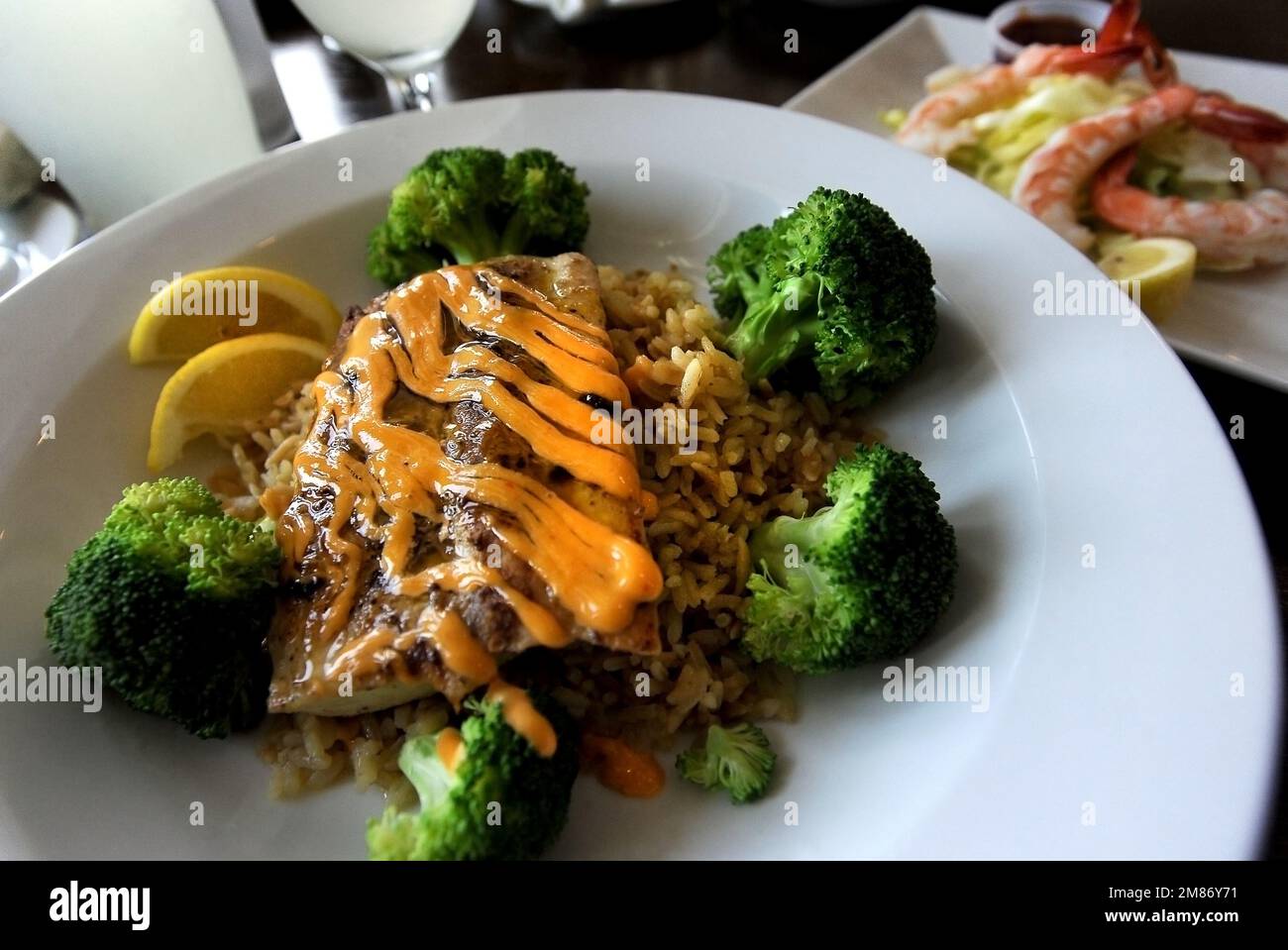 Mahi Mahi on rice pilaf is served Stock Photo - Alamy