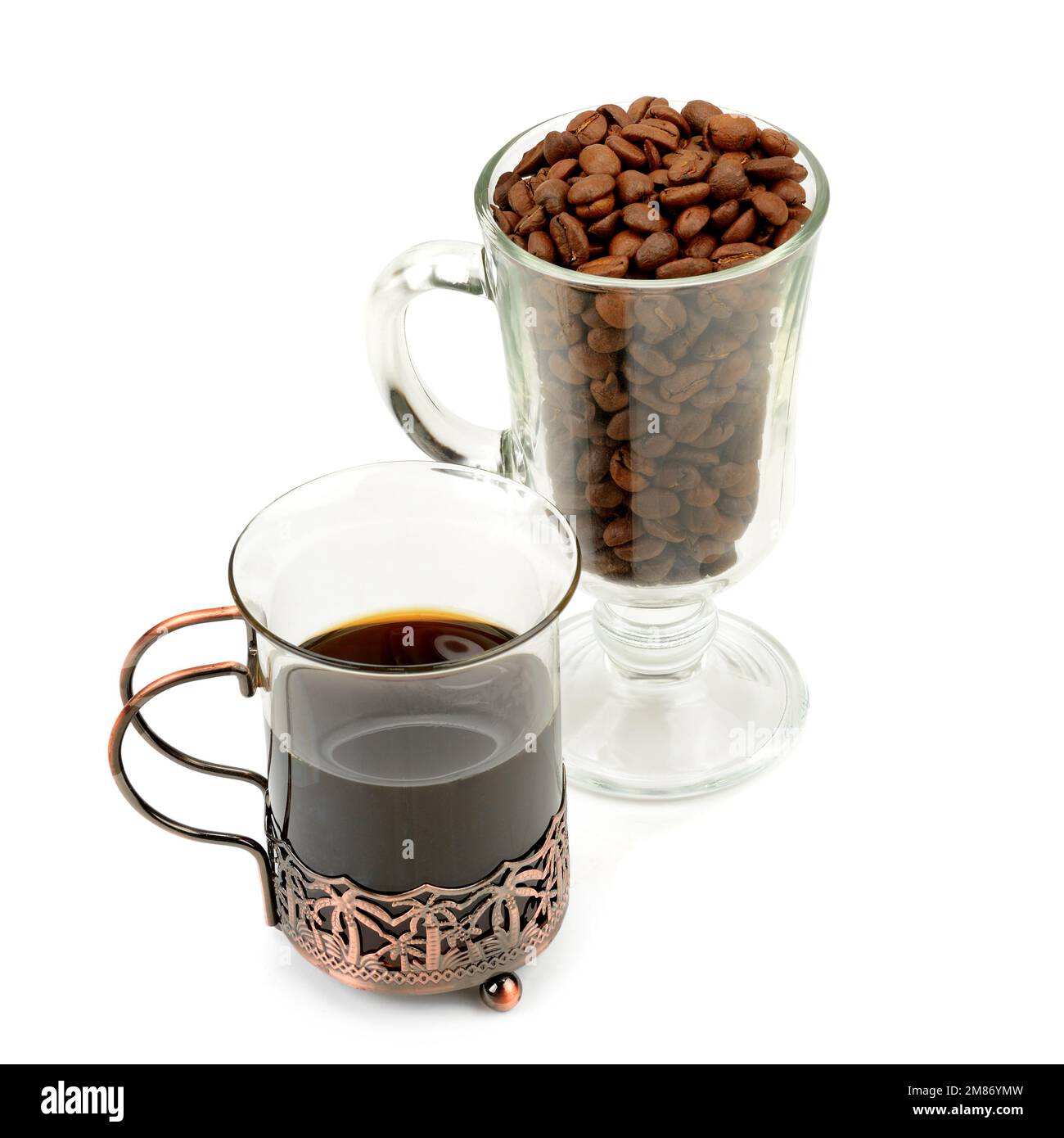 Hot coffee in a delicate glass and coffee beans isolated on white ...
