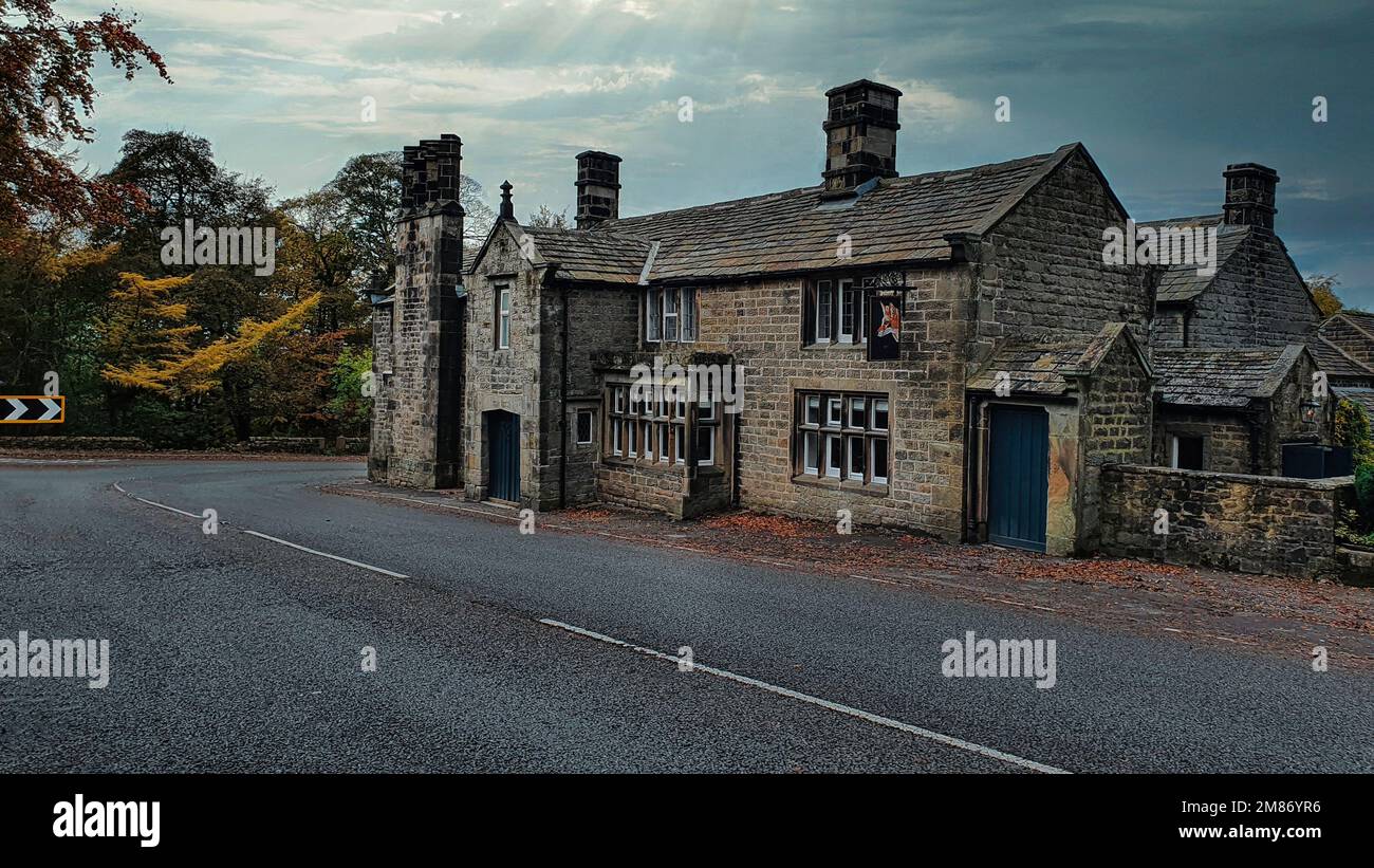 An English country house and a pub on a road Stock Photo - Alamy