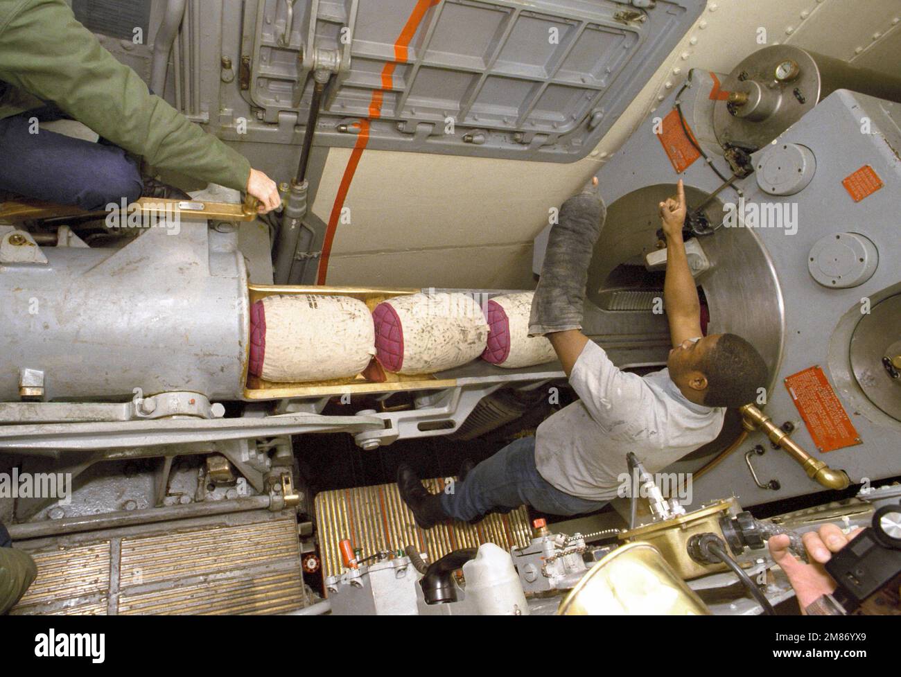 The gun captain of the center Mark 7 16-inch/50-caliber gun in the No ...