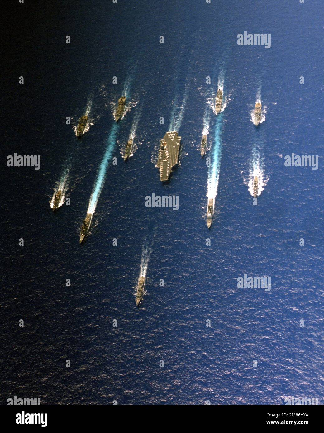 An aerial bow view of Battle Group Charlie underway in formation. The ...