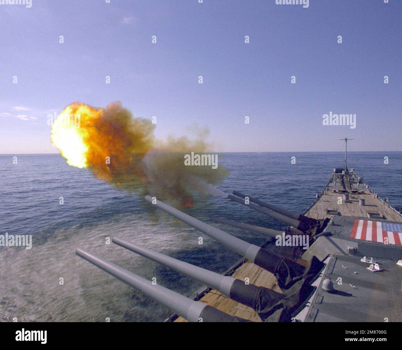 A projectile is fired from the center Mark 7 16-inch/50-caliber gun in ...