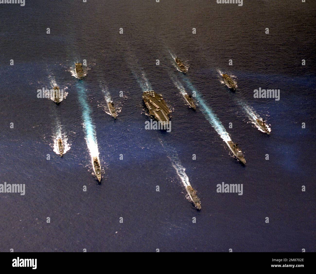 An aerial bow view of Battle Group Charlie underway in formation. The ...