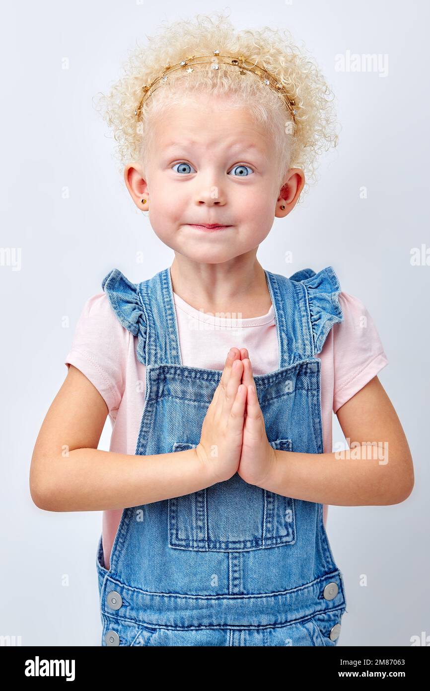 portrait of smiling and cute little blonde-haired girl. happy kid ...
