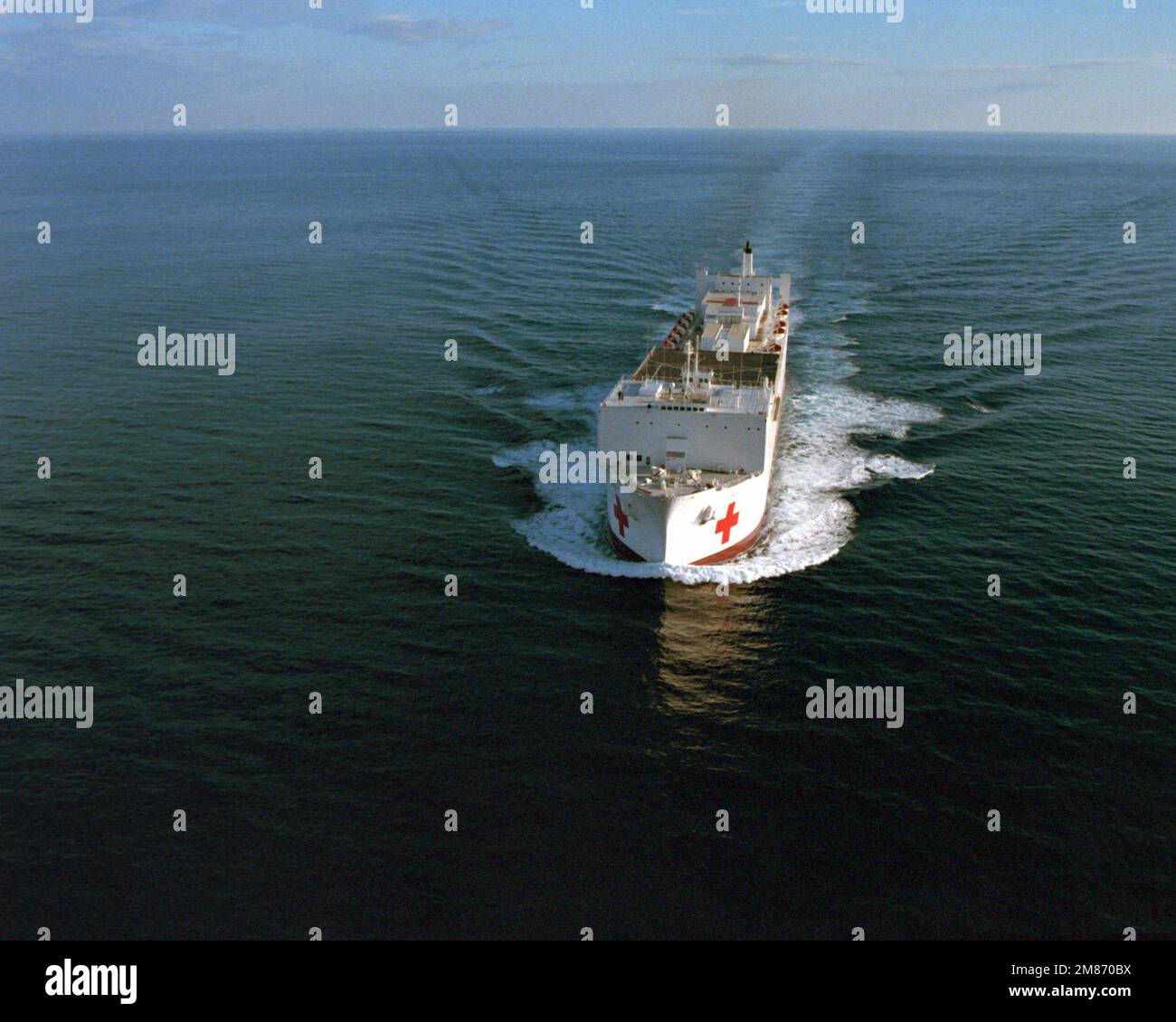 A bow view of the hospital ship USNS MERCY (T-AH-19) underway during ...