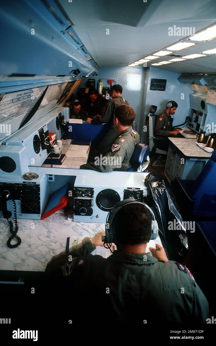 Air crew members aboard an EC-135 Stratolifter aircraft code-named the ...