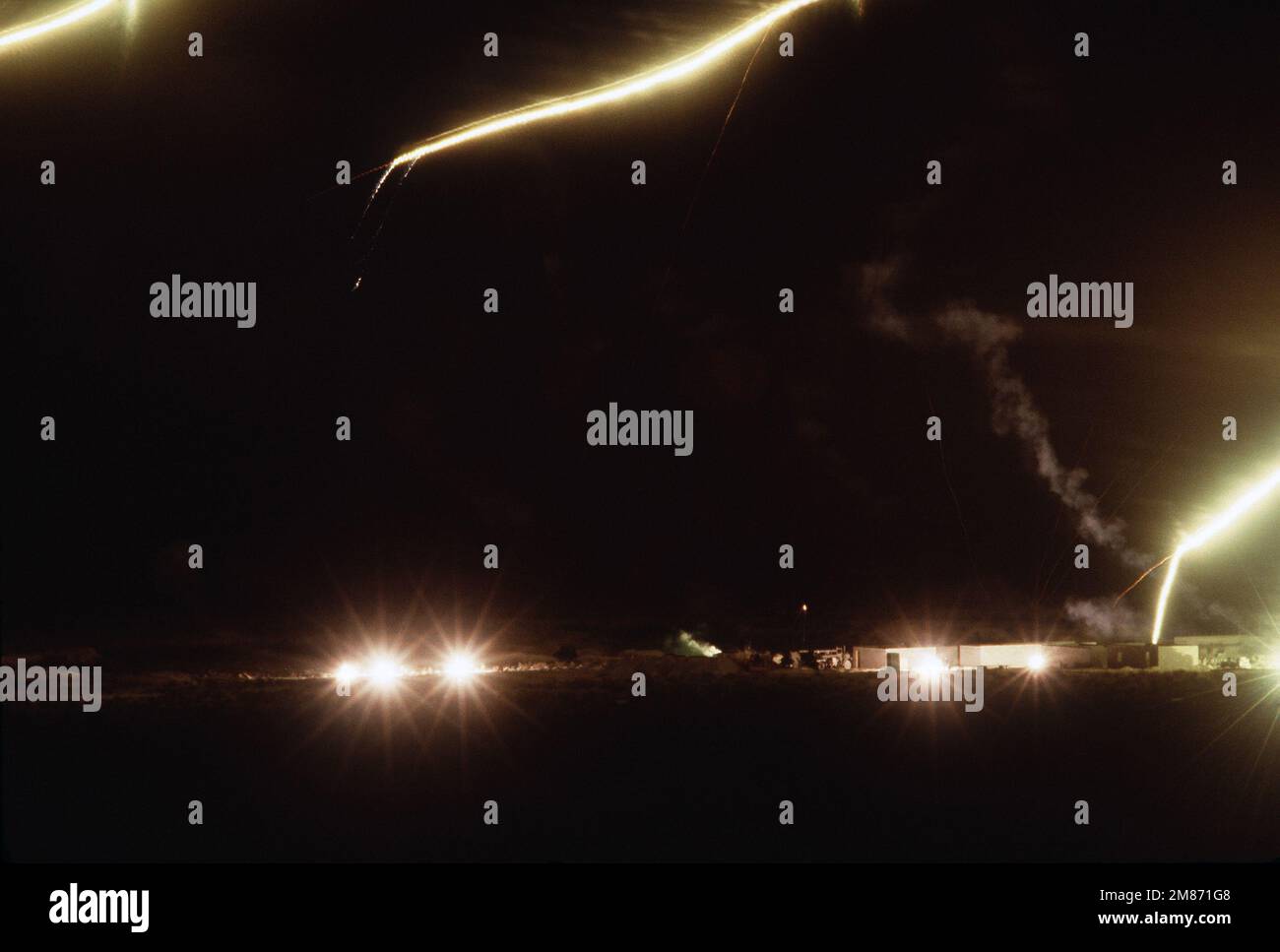 Tracer fire lights the night sky during a simulated village takeover ...