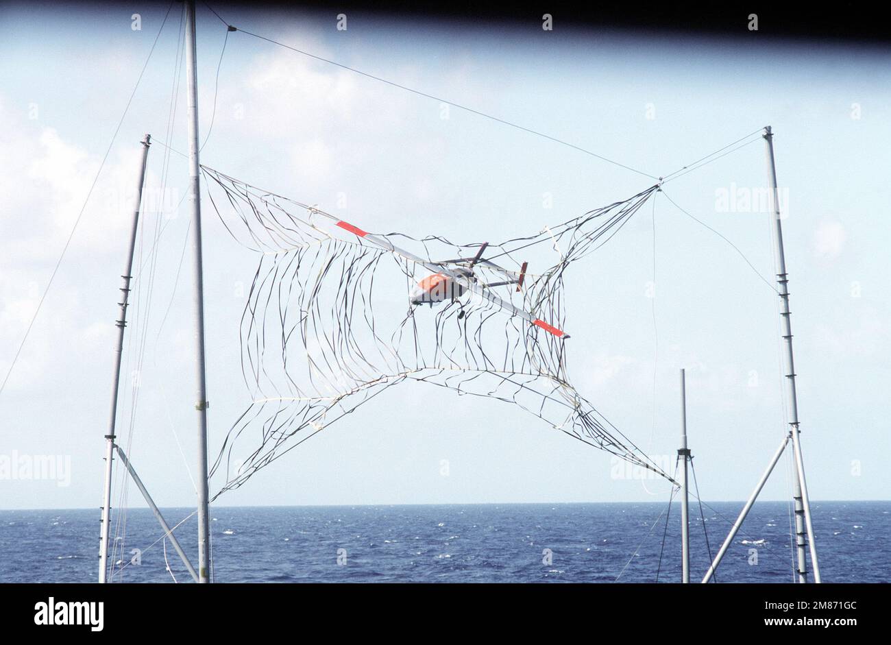 A Pioneer I remotely piloted vehicle (PV) approaches a recovery net ...