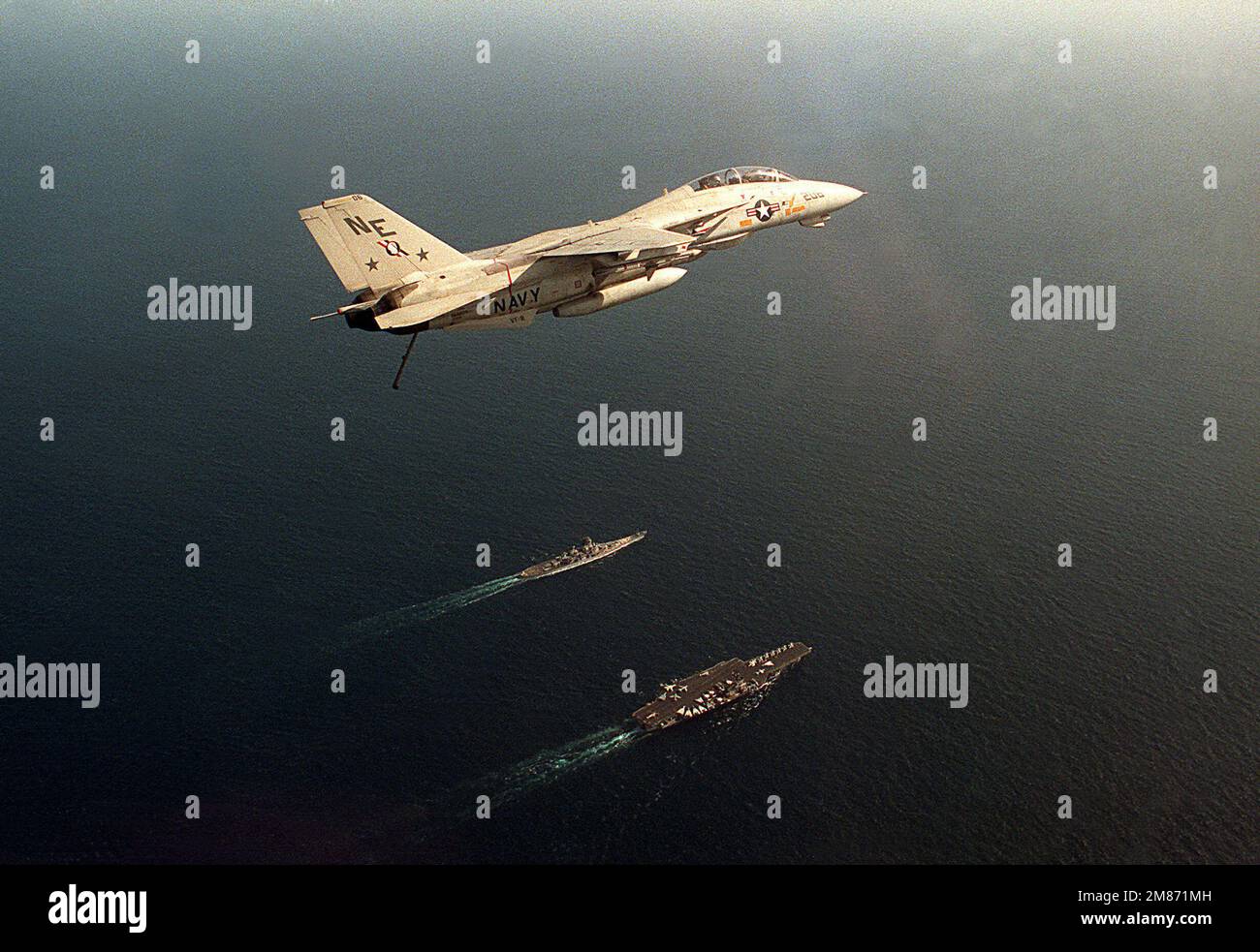 A Fighter Squadron 2 (VF-2) F-14A Tomcat aircraft passes over the ...