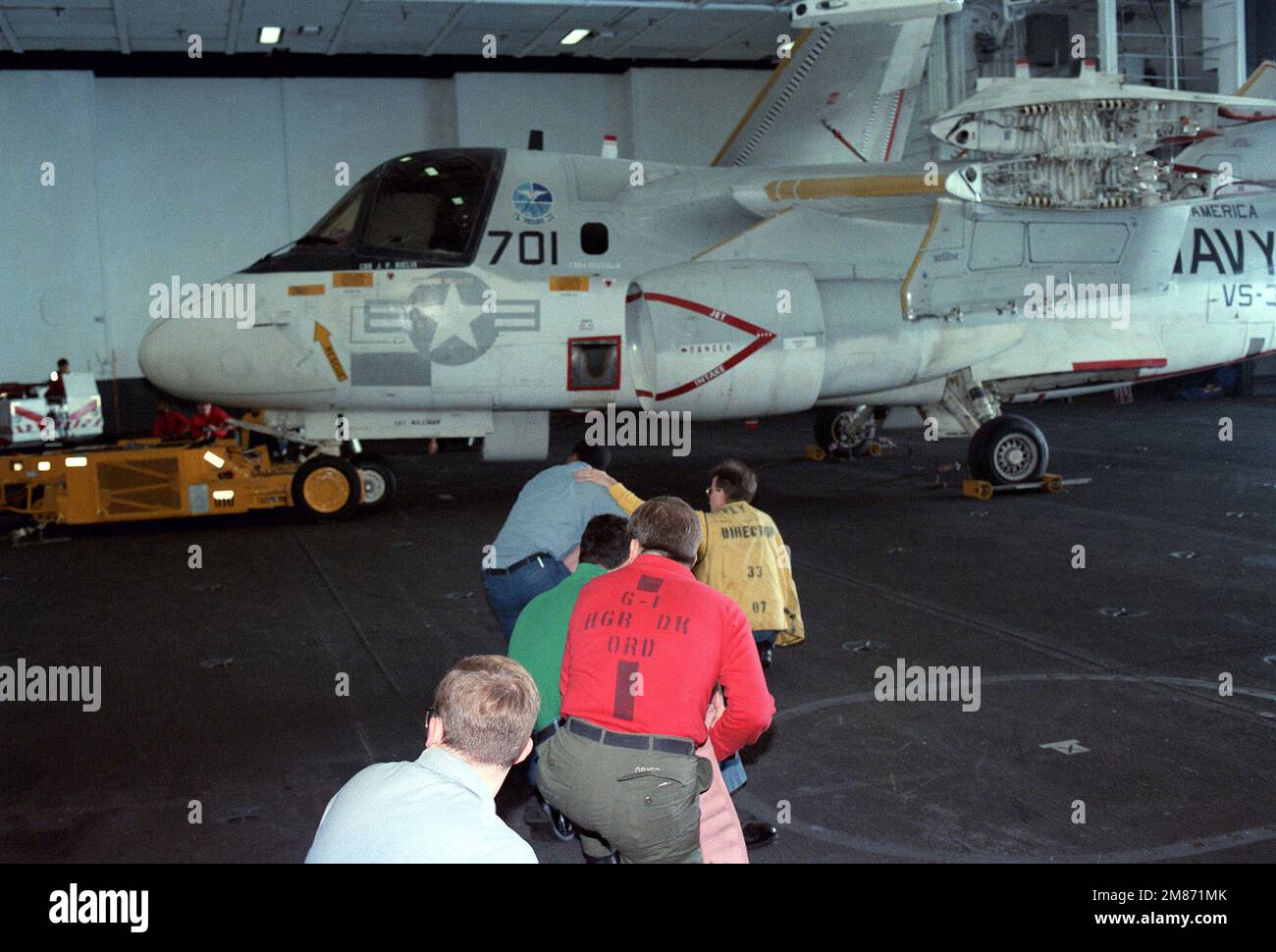 Crew members practice firefighting techniques during a general quarters ...