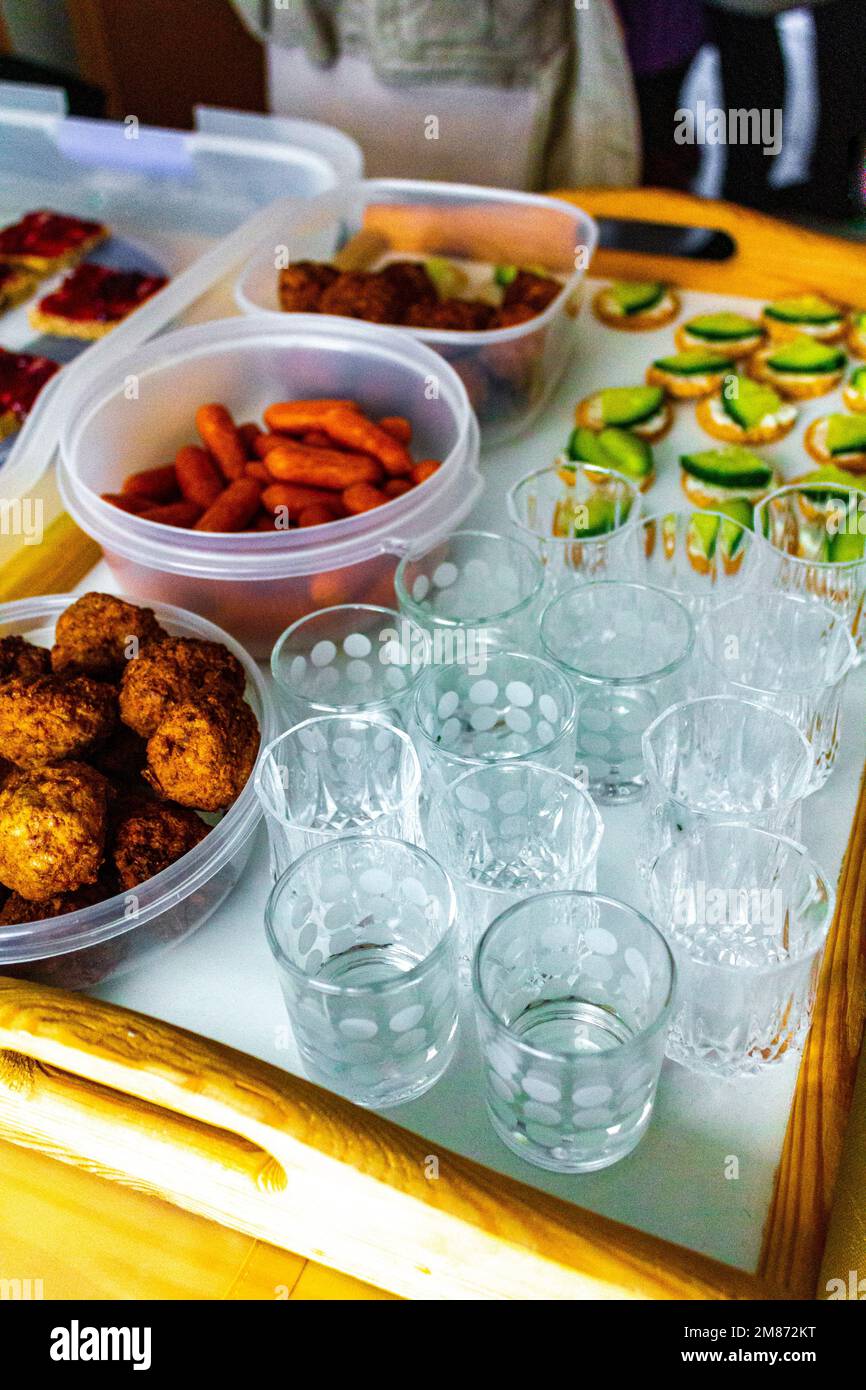 Small snacks finger food with salmon cheese salami ham tomato and herbs ...