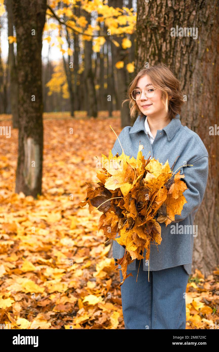 Vertical portrait of stylish, playful, smiling blond woman in ...