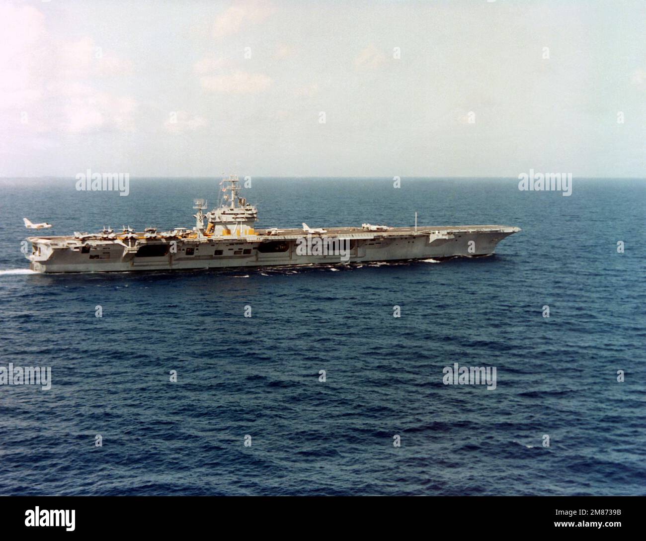 A starboard view of the nuclear-powered aircraft carrier USS THEODORE ROOSEVELT (CVN-71 ...