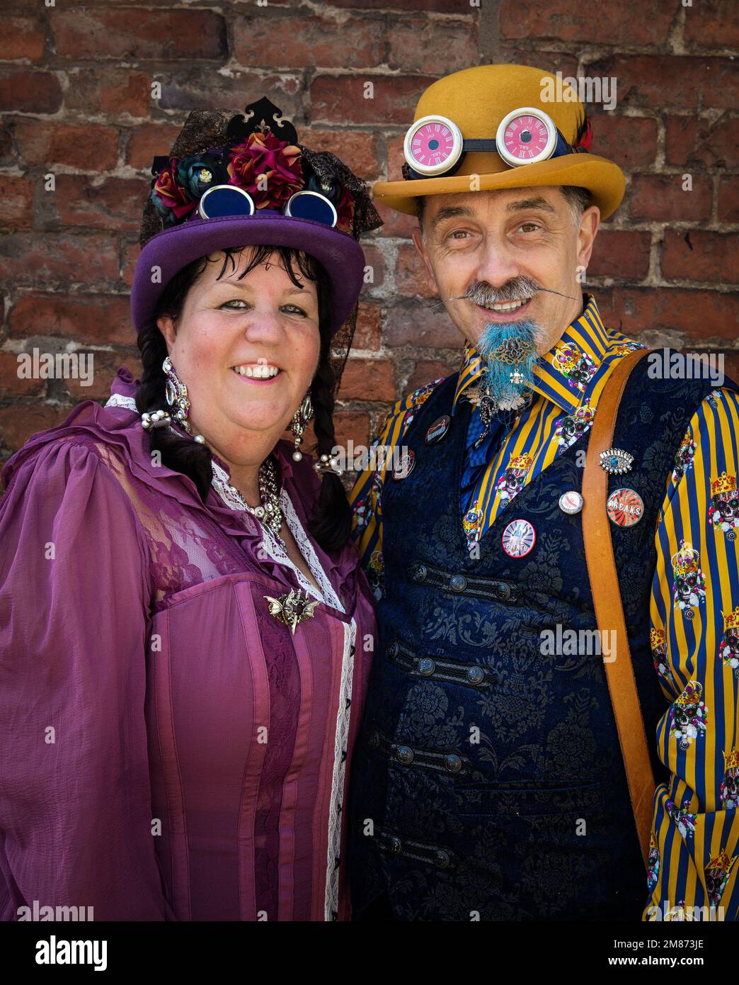 Portrait of a male and female steampunk. Steampunk couple. Smiling ...