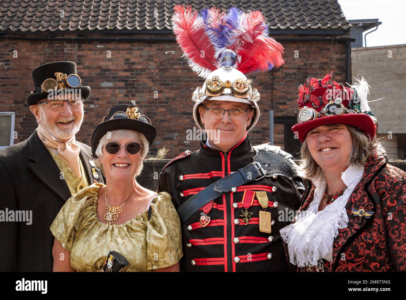 Portrait of a middle aged group of steampunks wearing period and ...