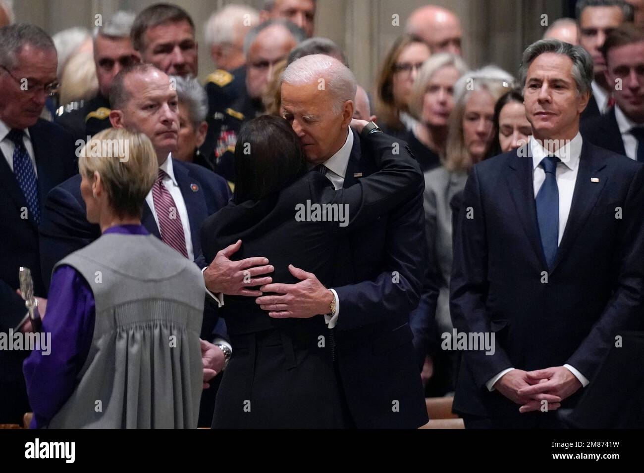 President Joe Biden embraces Stephanie Carter, widow of Defense ...
