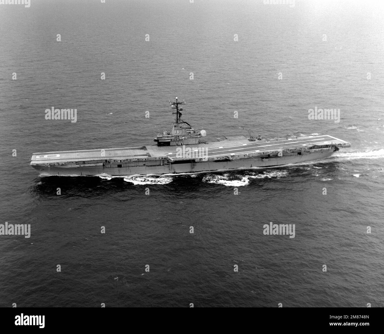 An aerial port view of the training aircraft carrier USS LEXINGTON (AVT ...