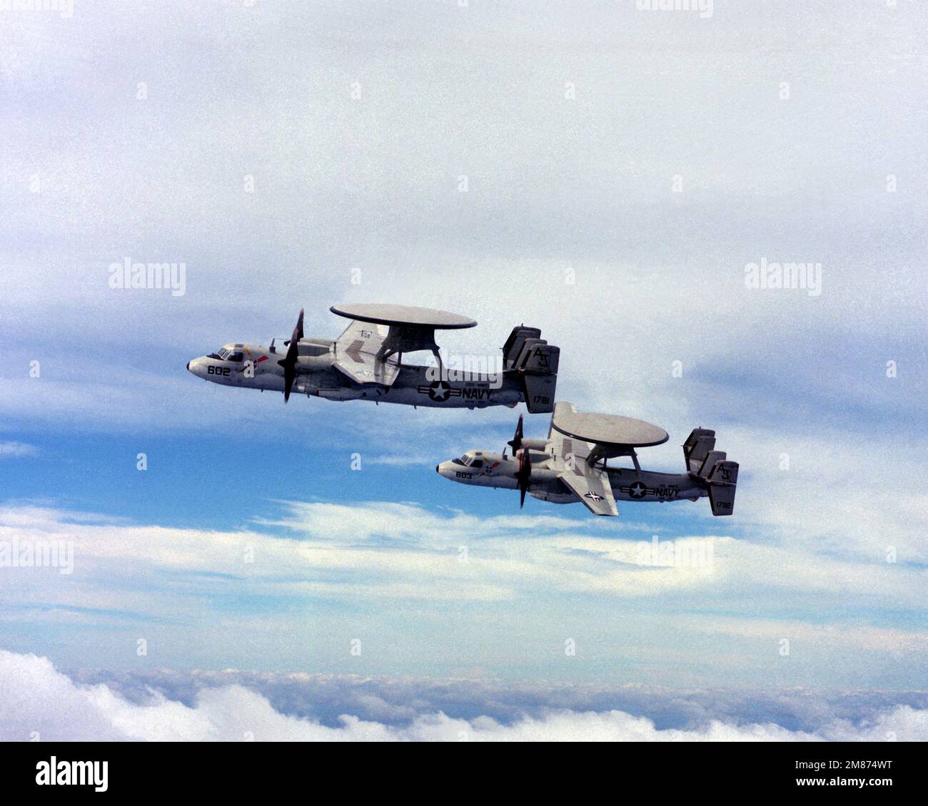 An air-to-air left side view of two Airborne Early Warning Squadron 124 ...