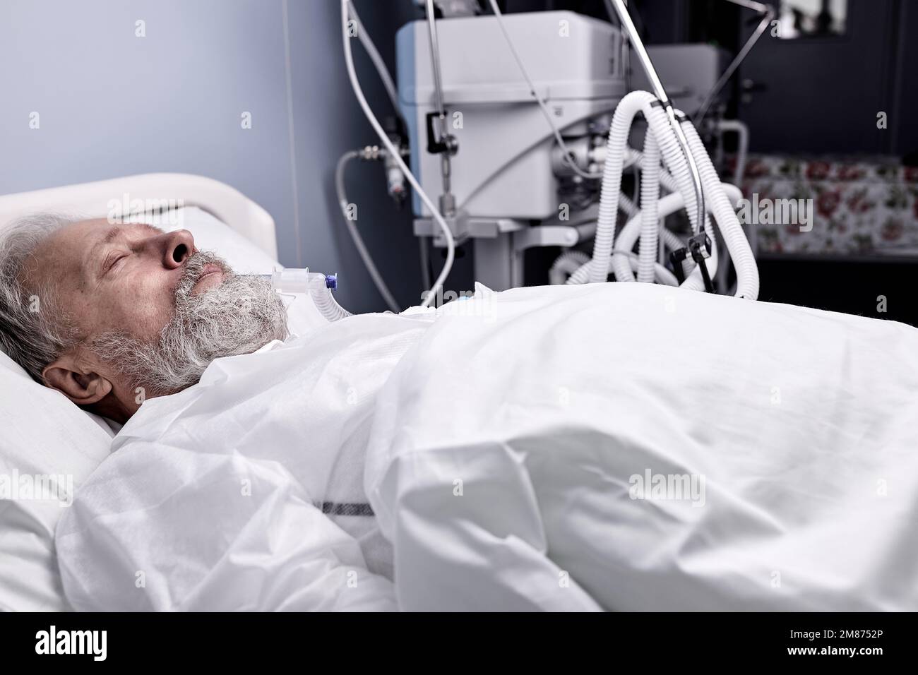 covid-19 patient with Endotracheal Tube In Mouth Lying On Medical Couch ...