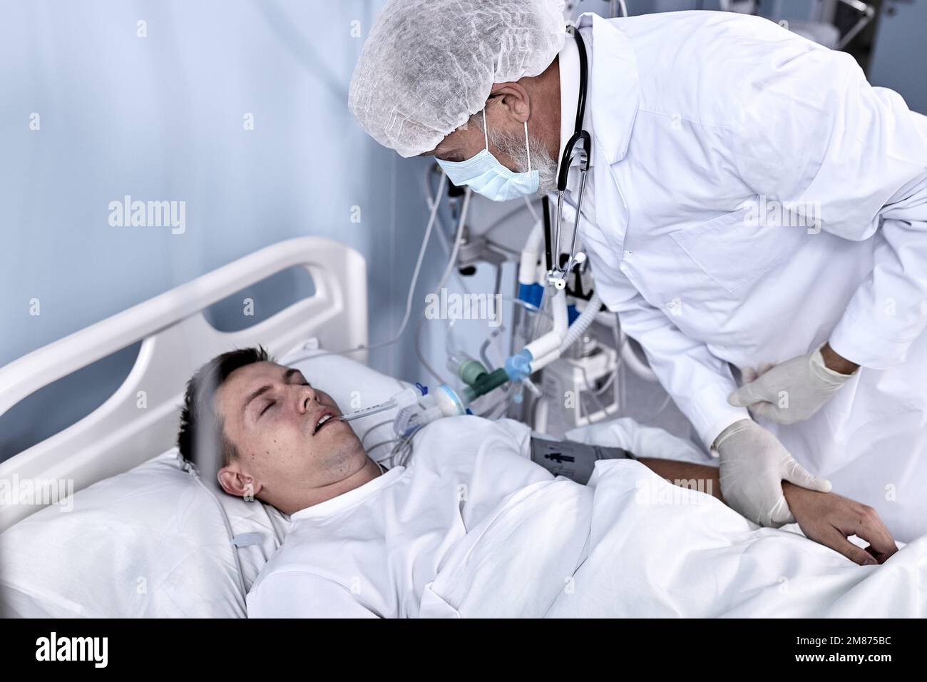 Senior Male Doctor Check the Pulse and the Patient's Health Condition ...