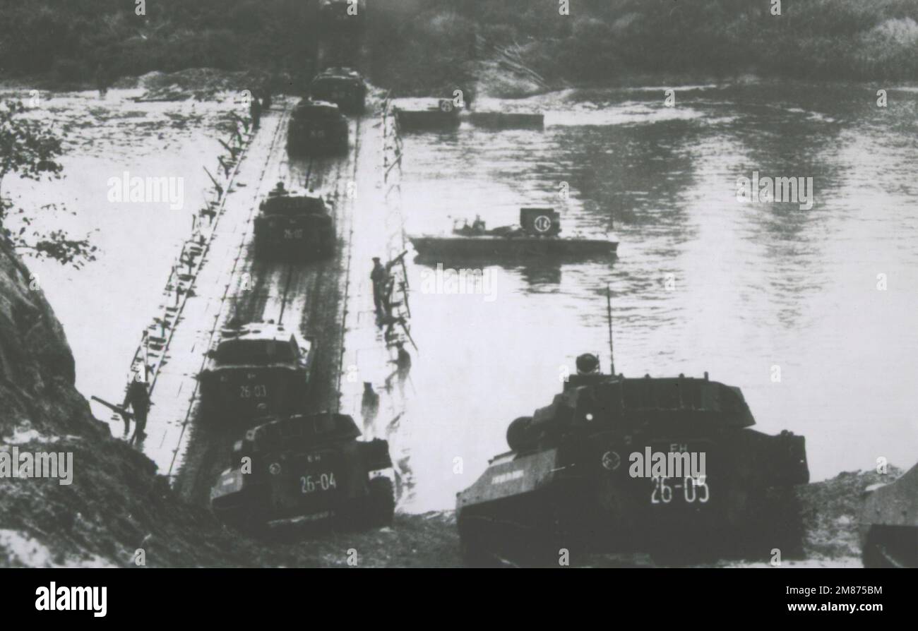 Soviet infantry vehicles cross a pontoon bridge during a field exercise ...
