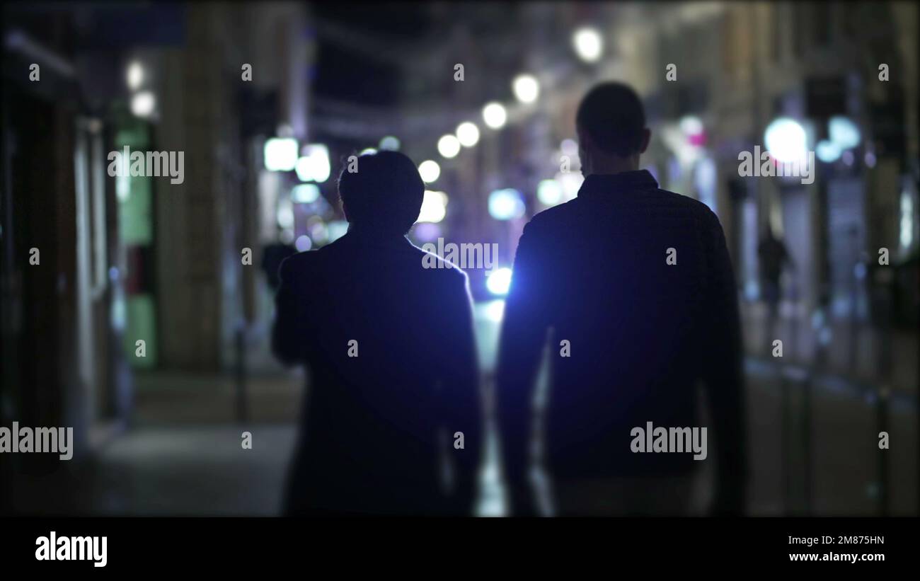 Two friends walking night hi-res stock photography and images - Alamy