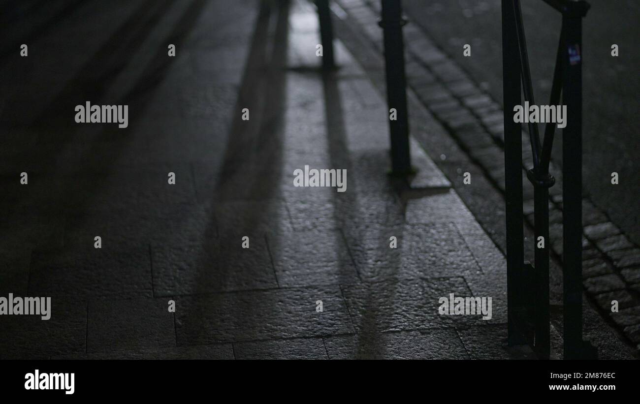 Light shadows from cars passing by at night in sidewalk city Stock ...