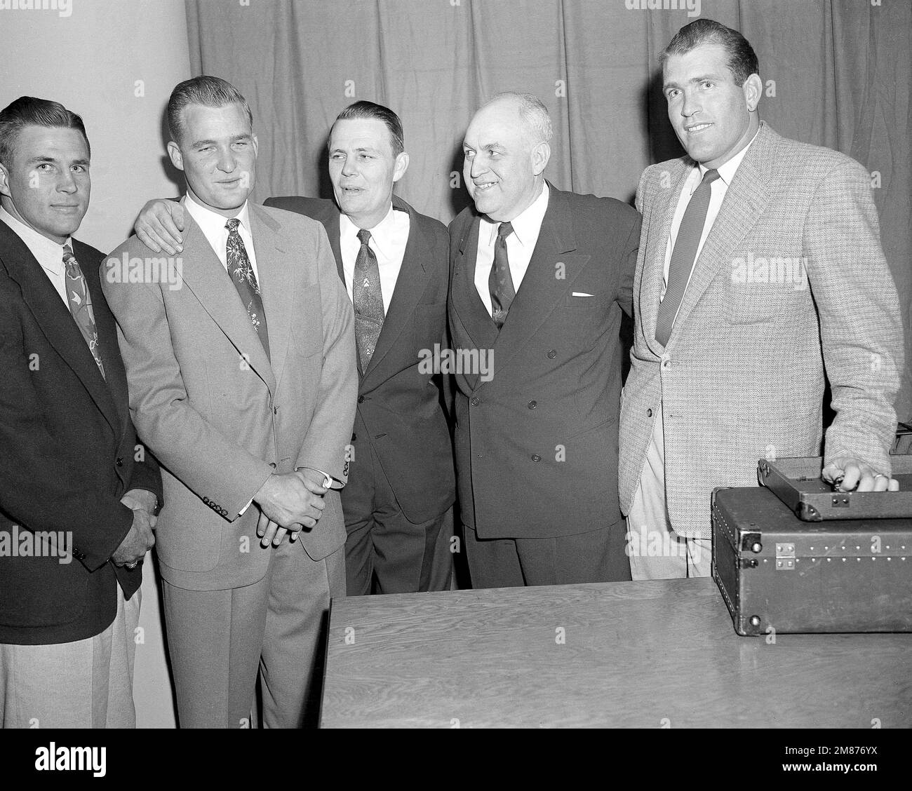 Detroit Lions quarterback Bobby Layne, second from left, attends the ...