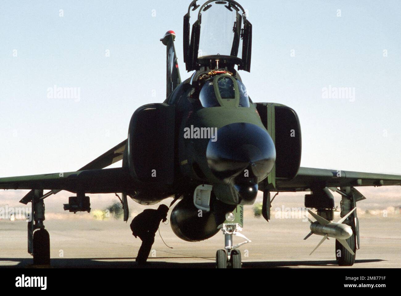 A ground crew member performs a preflight check on a 334th Tactical ...