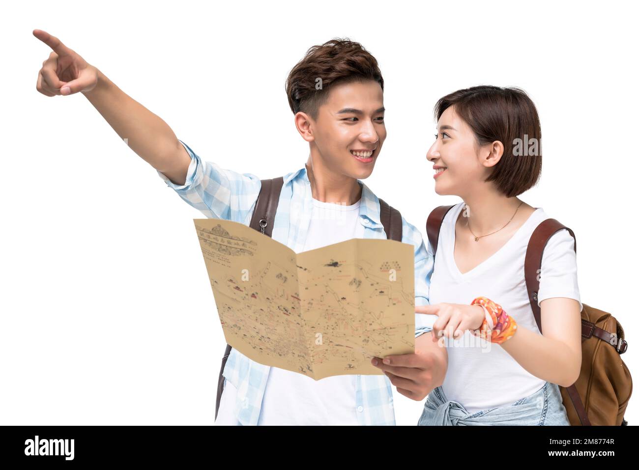 Happy young couple holding a map Stock Photo - Alamy