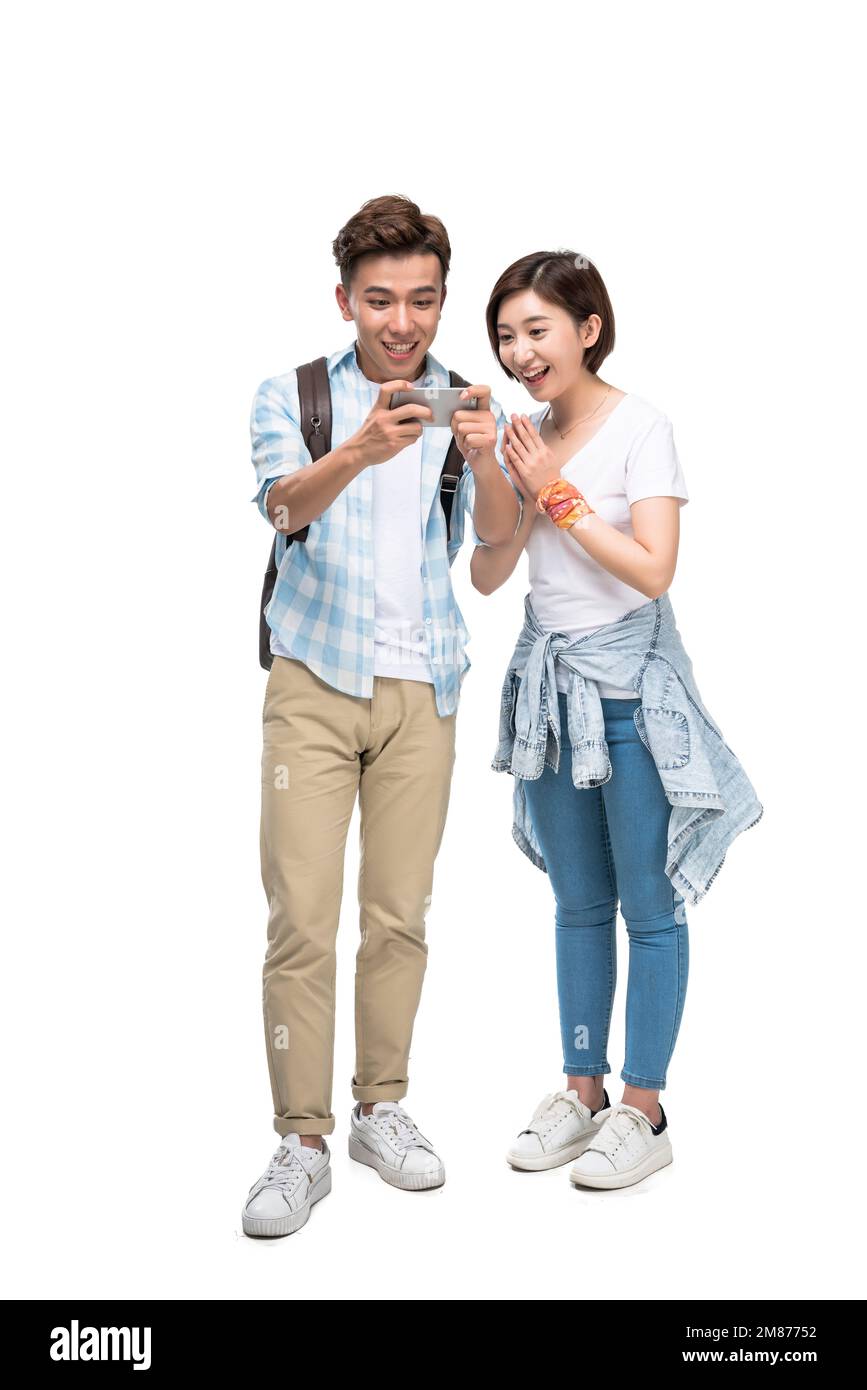 Young men women holding phones Cut Out Stock Images & Pictures - Alamy
