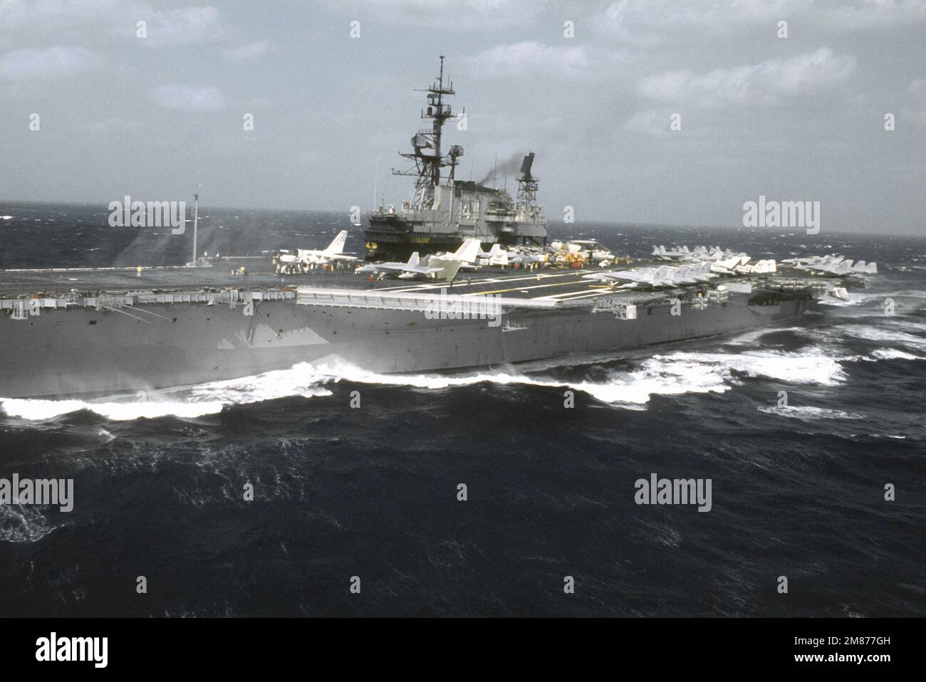 A port bow view of the aircraft carrier USS MIDWAY (CV-41) underway in ...