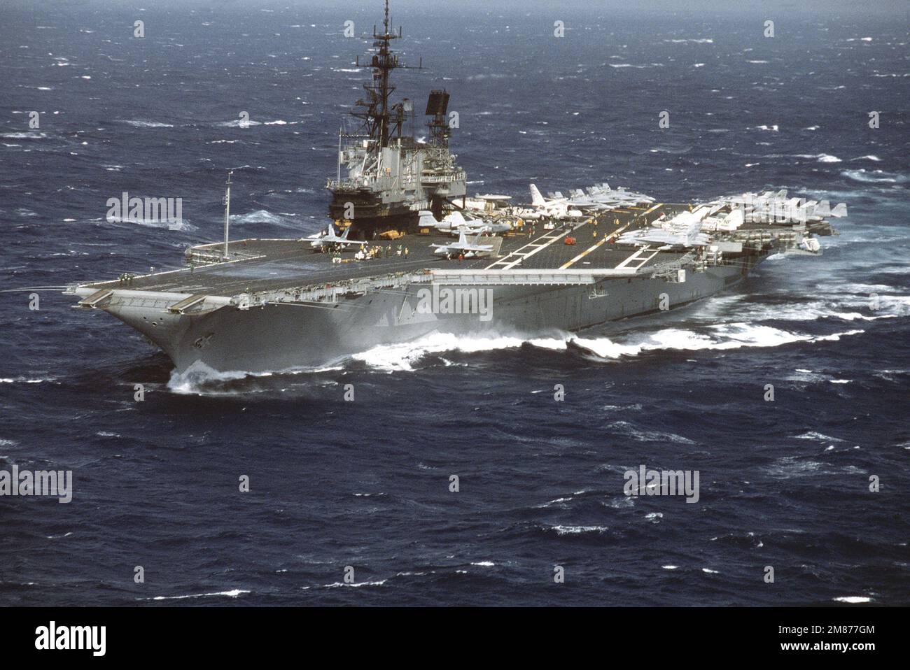 A port bow view of the aircraft carrier USS MIDWAY (CV-41) underway in ...