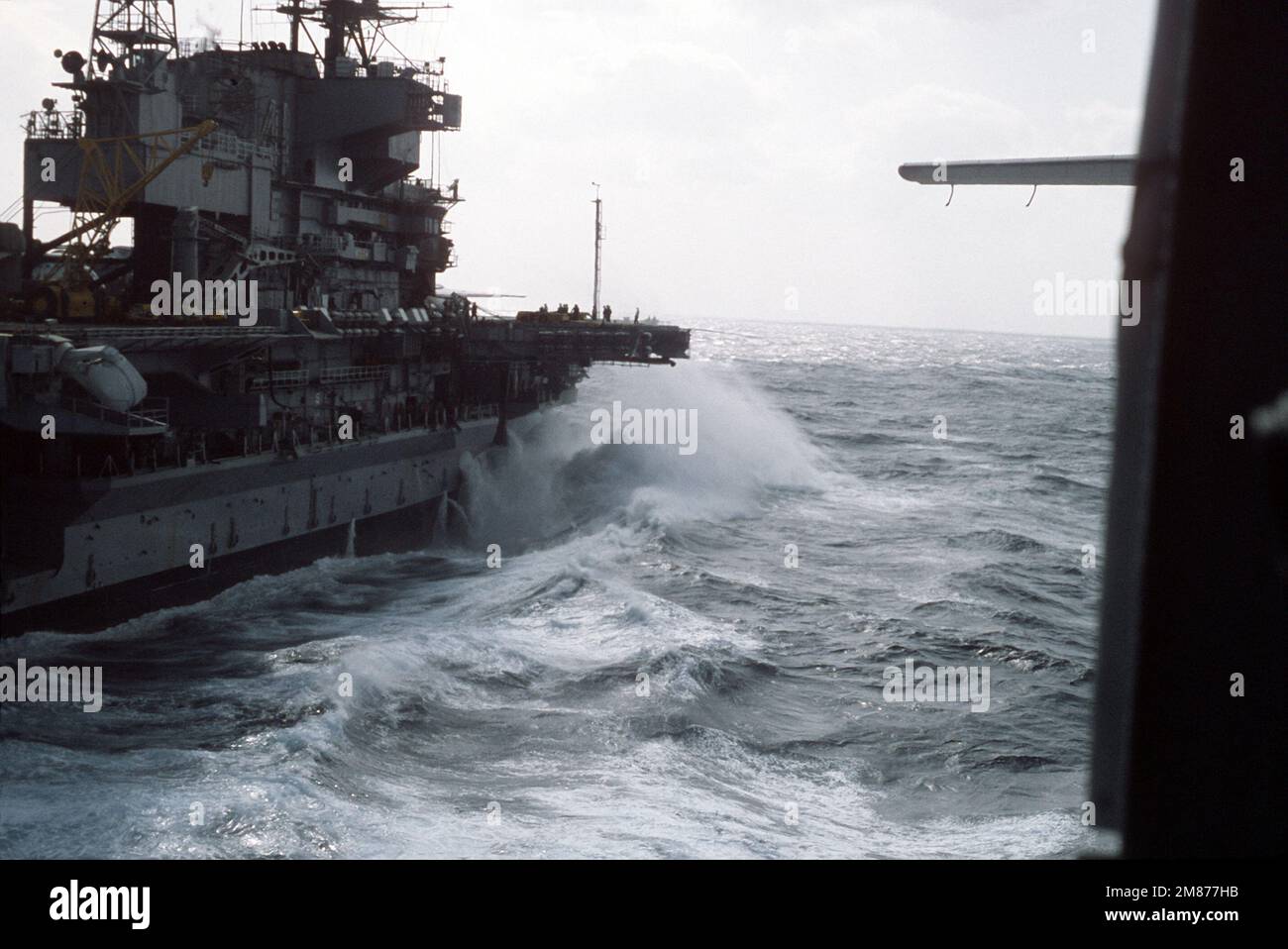 A starboard view of the stern section of the aircraft carrier USS ...