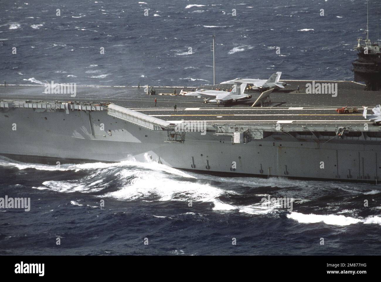 F/A-18 Hornet aircraft are readied for launch from the flight deck of ...