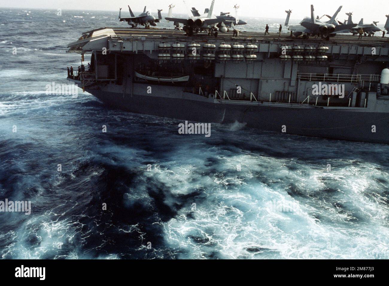 A starboard view of the stern section of the aircraft carrier USS ...