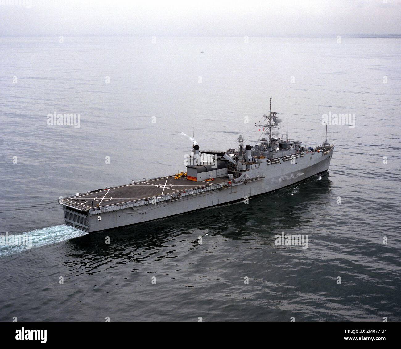 A starboard quarter view of the amphibious transport dock USS OGDEN ...
