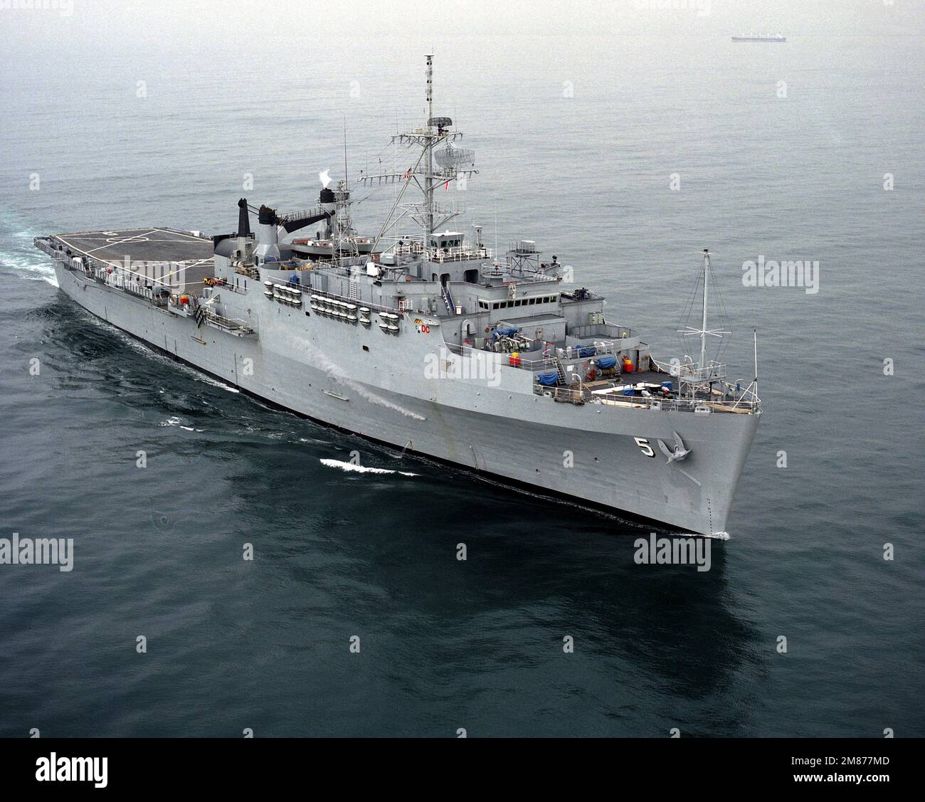 A starboard bow view of the amphibious transport dock USS OGDEN (LPD 5 ...