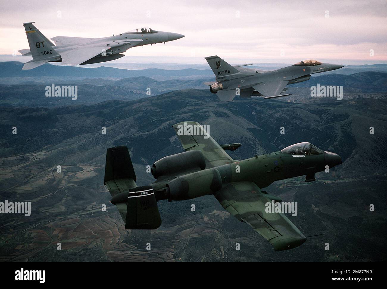 An air-to-air right side view of, from front to back, a 511th Tactical ...