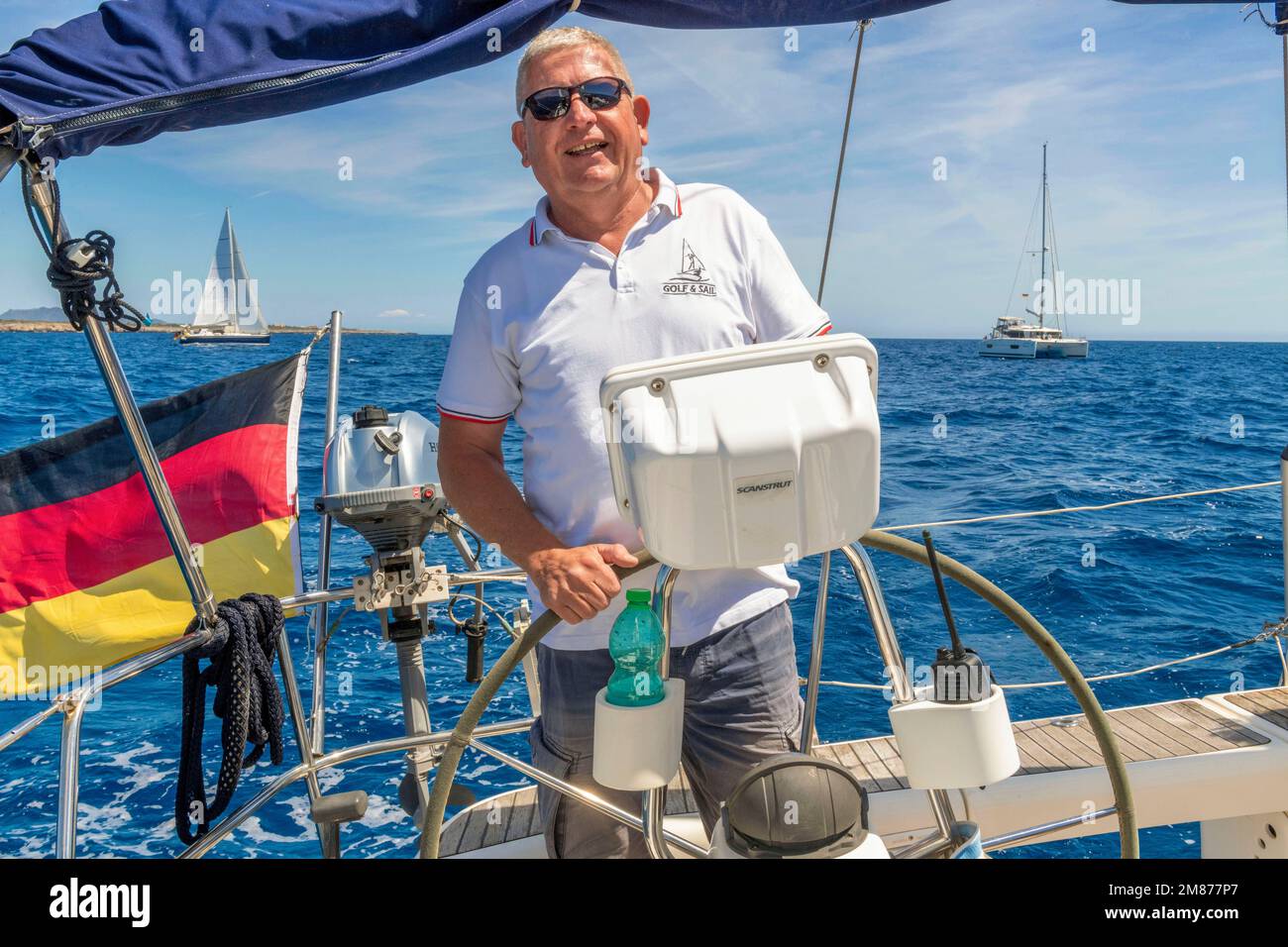A German skipper is sailing a Bavaria 43 Cruiser off Porto Cristo ...