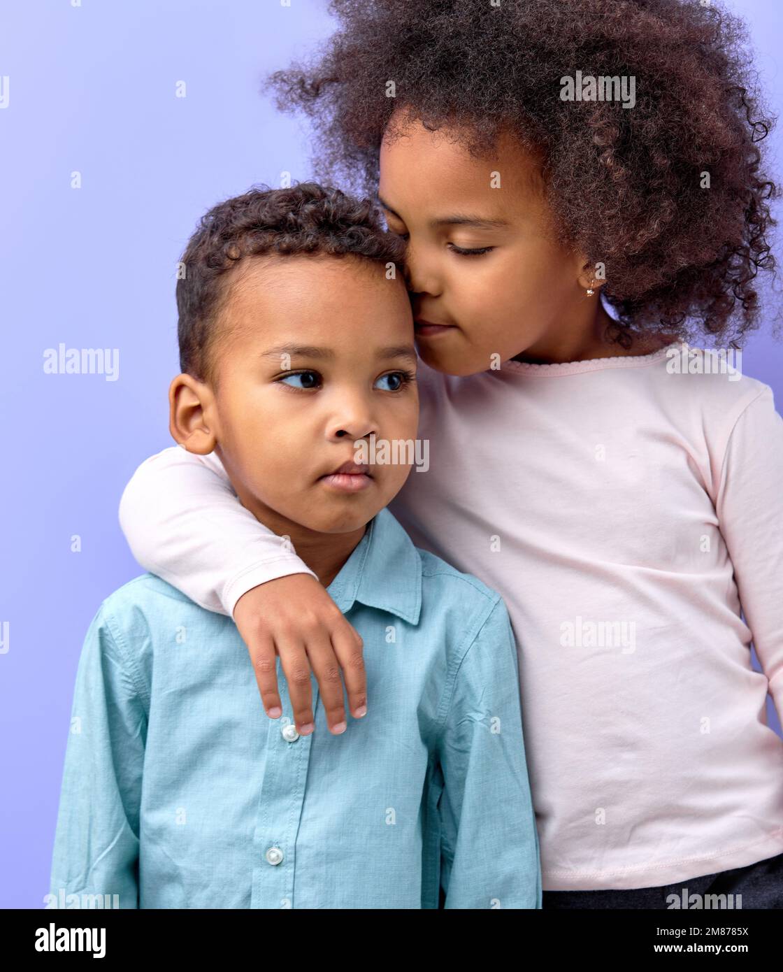 Photo of two young little black kids happy embrace family together ...
