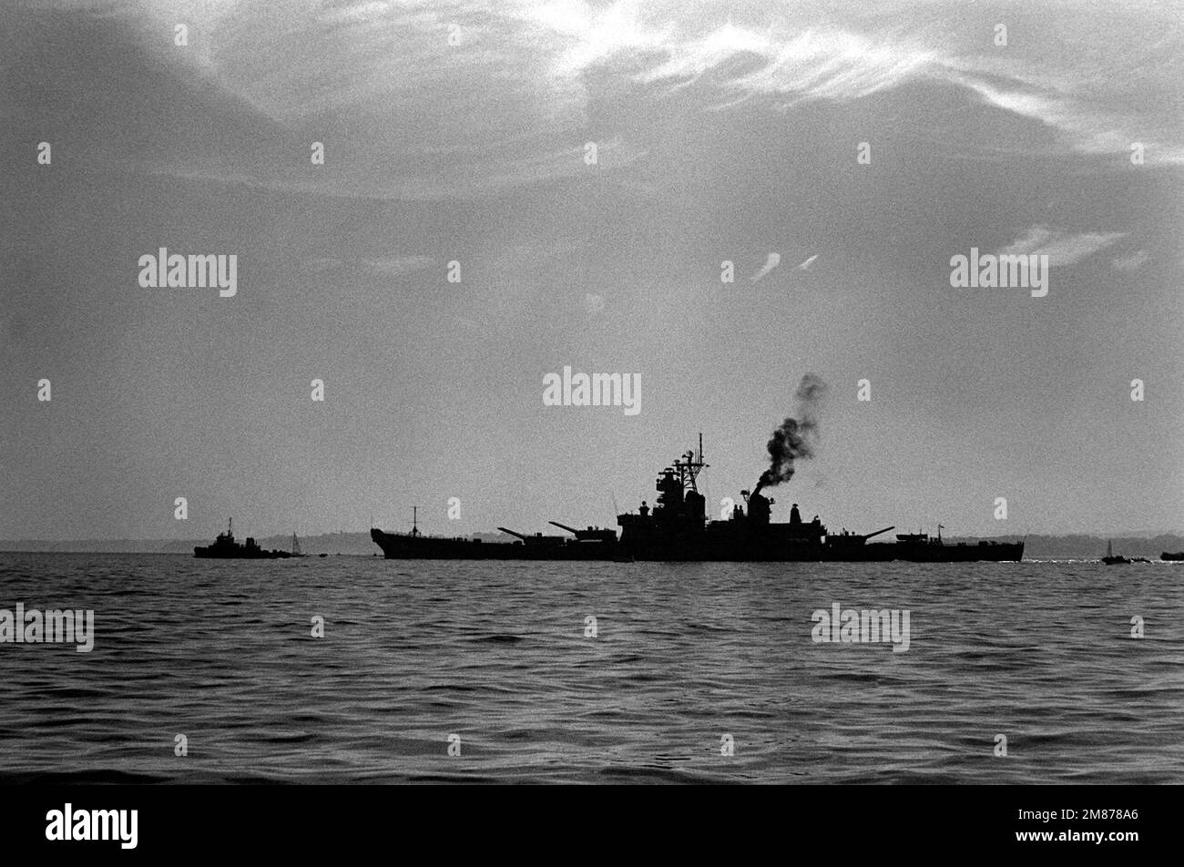 A silhouetted port beam view of the battleship USS IOWA (BB-61)underway. Country: Atlantic Ocean ...