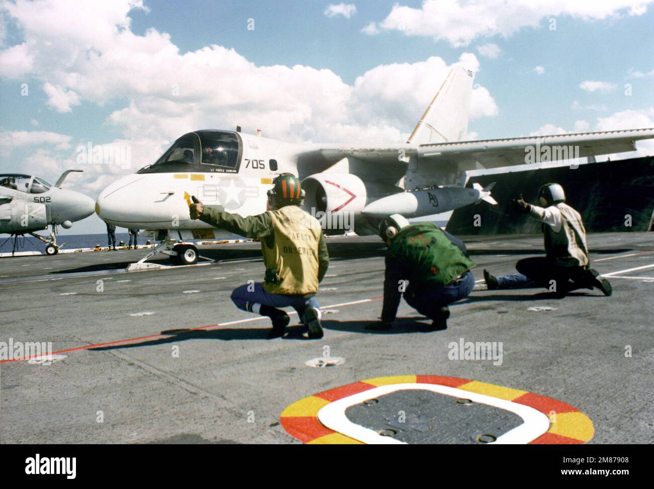 Catapult crewmen give the thumbs up signal prior to the launch of an S ...