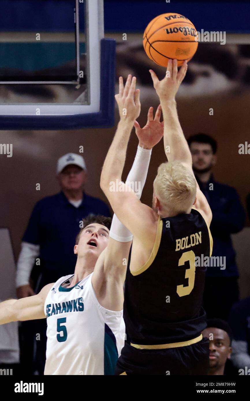 Charleston guard Dalton Bolon (3) shoots against UNC Wilmington guard ...