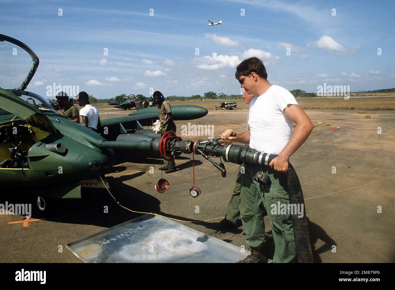A member of the 24th Fuel Management Division refuels an OA-37B ...