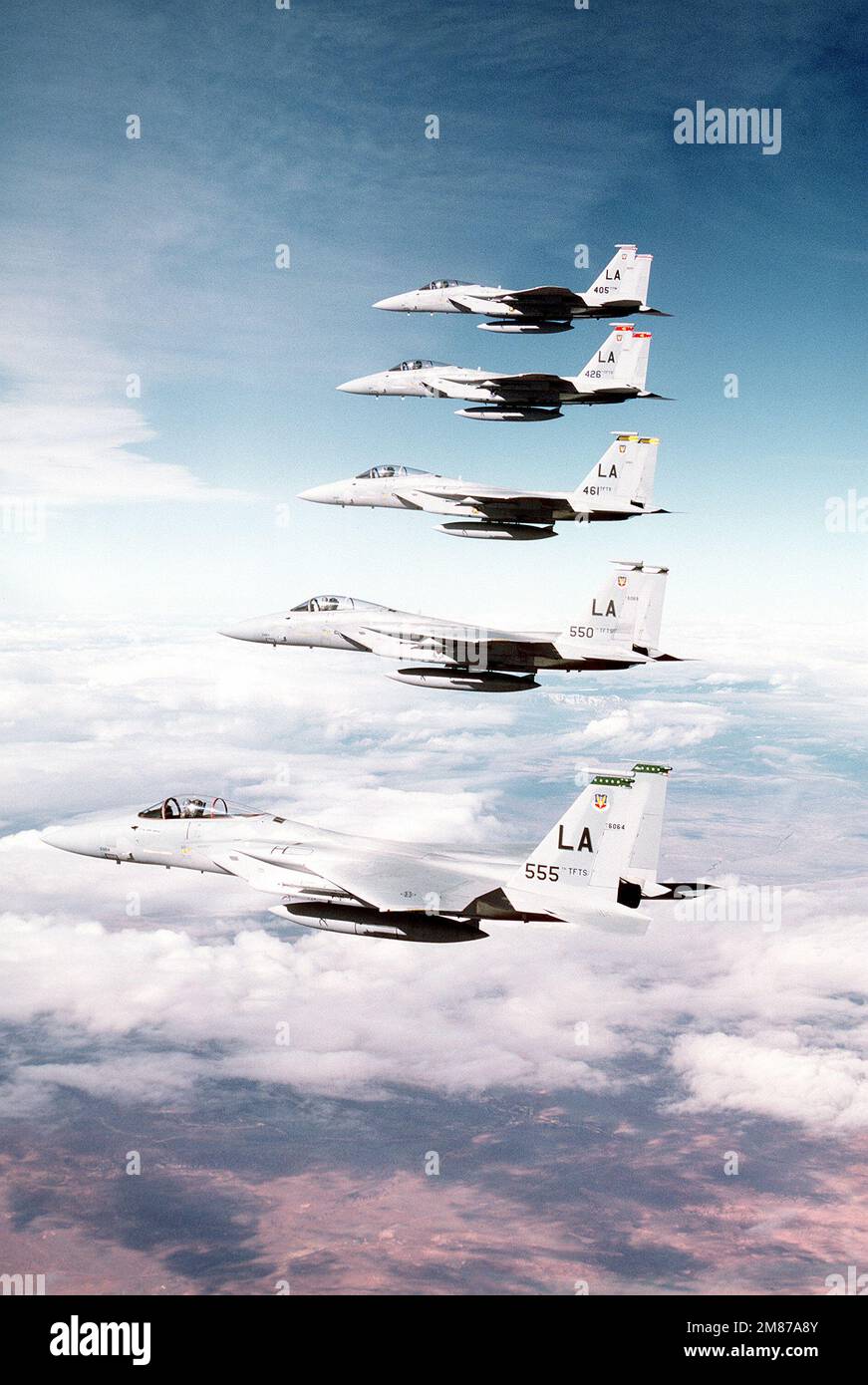 An air-to-air left side view of a flight of five F-15 "Eagles" flying ...