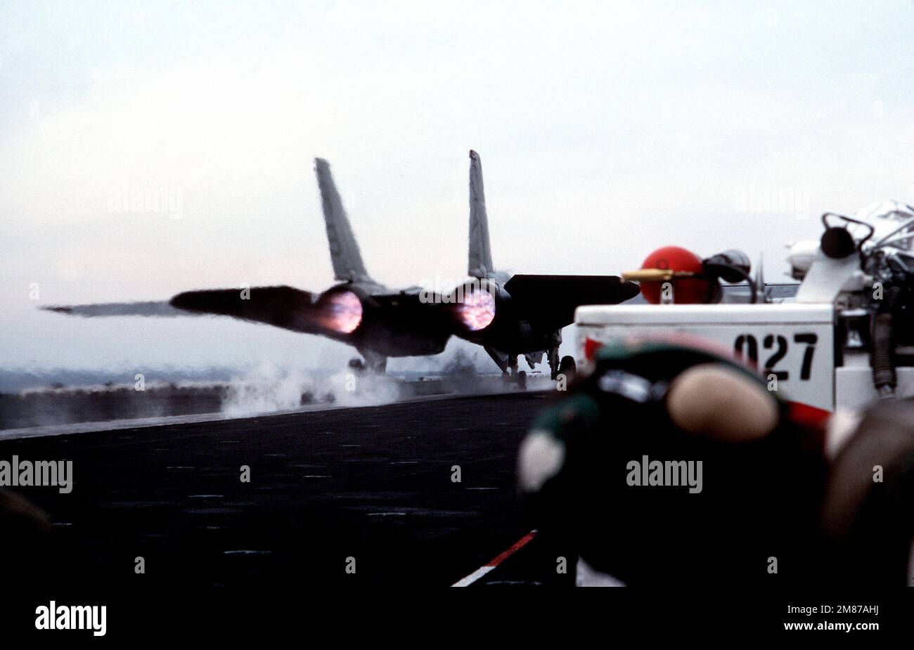 A Fighter Squadron 33 (VF-33) F-14A Tomcat aircraft is launched from ...