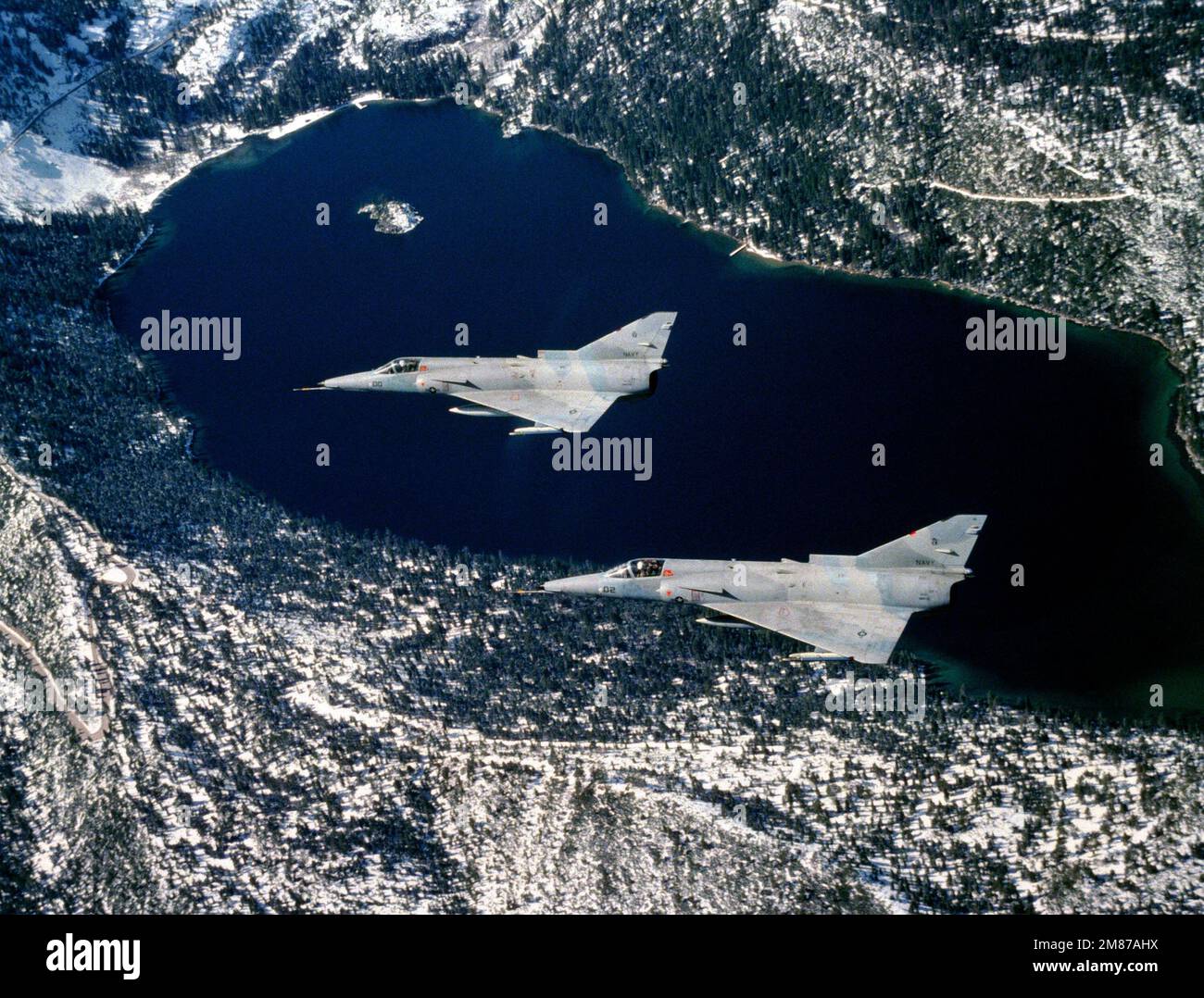 An air-to-air left side view of Fighter Squadron 43 (VF-43) F-21 Kfir ...
