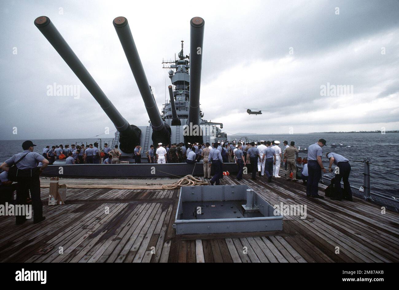 Crew members muster on the forecastle of the battleship USS IOWA (BB-61 ...